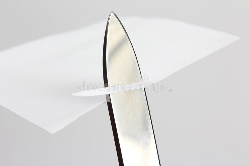 Blade of a Sharp Knife Cut Across the White Paper Stock Photo - Image ...