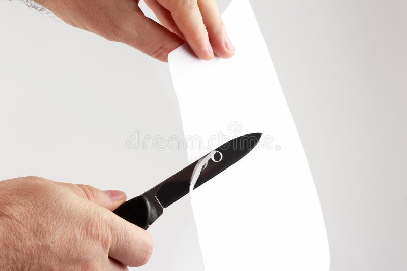Blade of a Sharp Knife Cut Across the White Paper Stock Photo - Image ...