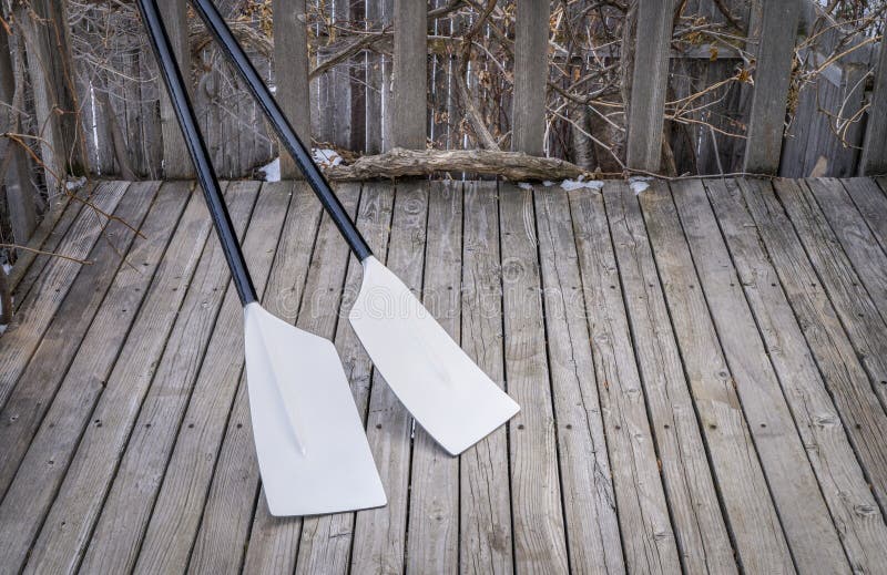 Blades of Hatchet Sculling Oars Against Grunge, Rustic Deck Stock Image ...