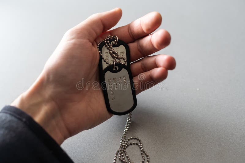 Blank Army Dog Tags in Hand on White Background Stock Image - Image of ...