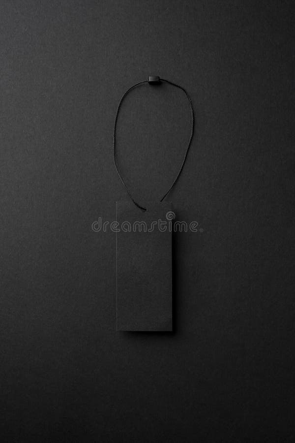 Blank Black Cardboard Clothing Tag with String on Black Background ...