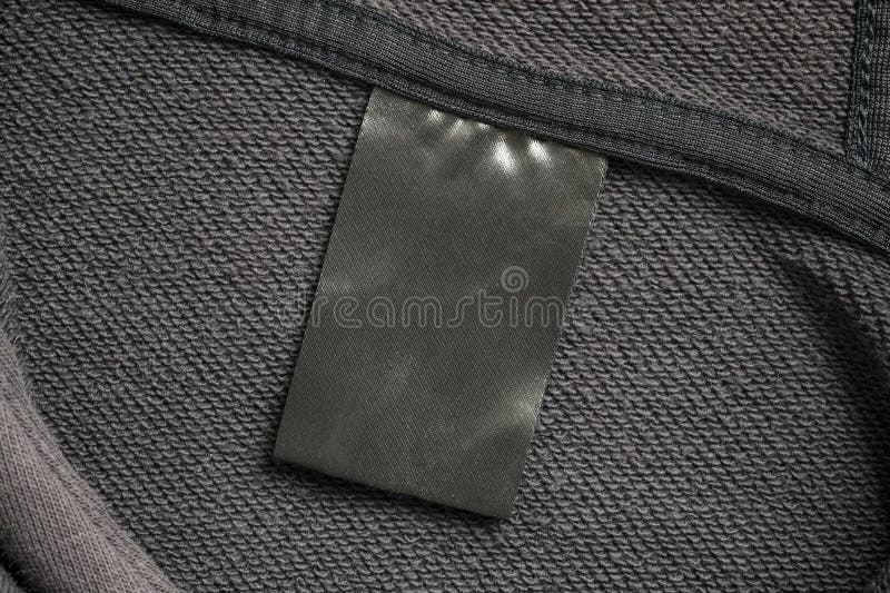 Blank Black Laundry Care Clothes Label on Black Fabric Texture ...