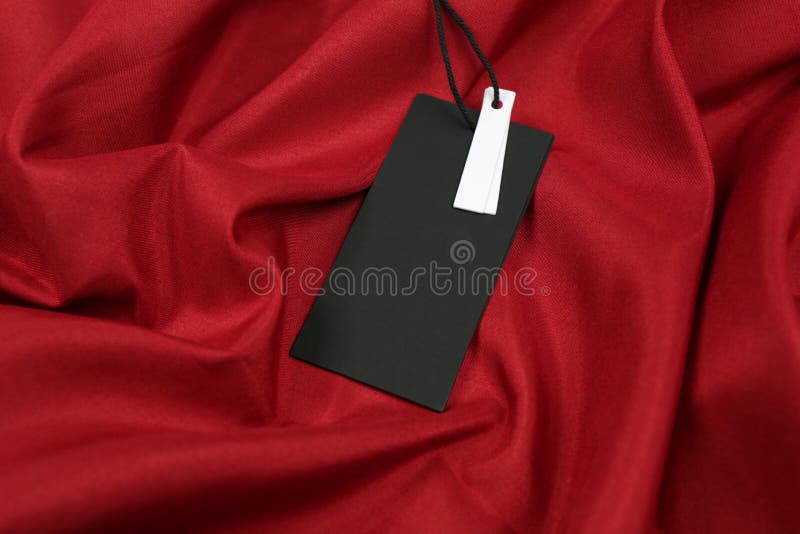 Blank Black Tag on Red Fabric. Space for Text Stock Photo - Image of ...
