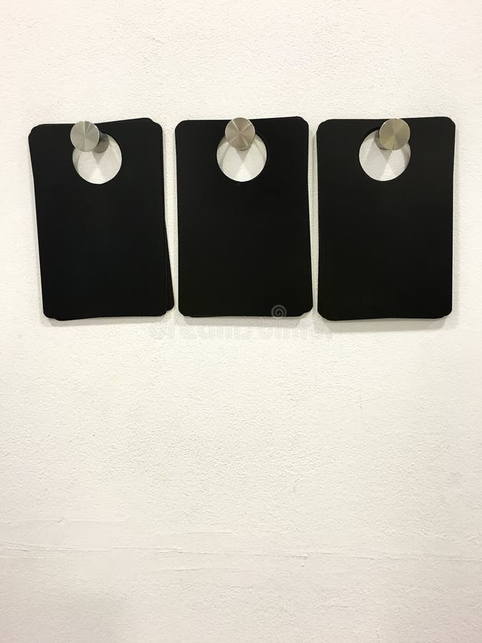 Blank Black Tags on White Wall Stock Photo - Image of grunge, labels ...