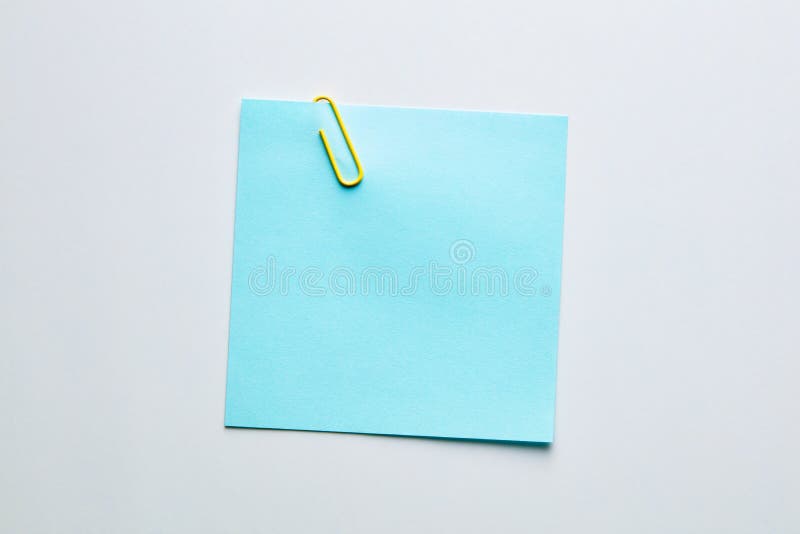 Blank Blue Note Paper or Notepad with a Yellow Paper Clip on White ...