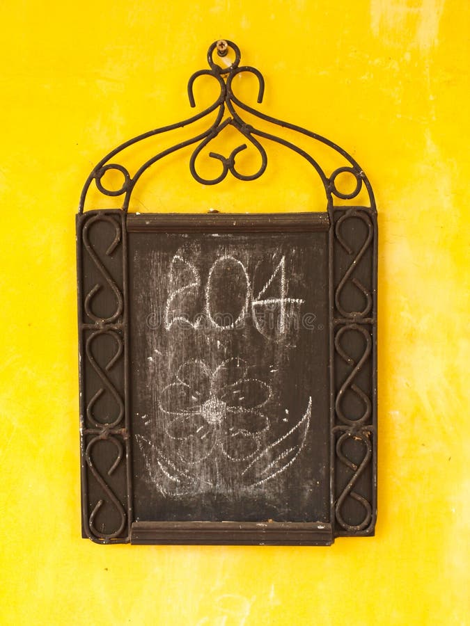 Blank board on yellow wall stock photo. Image of tavern - 30435550