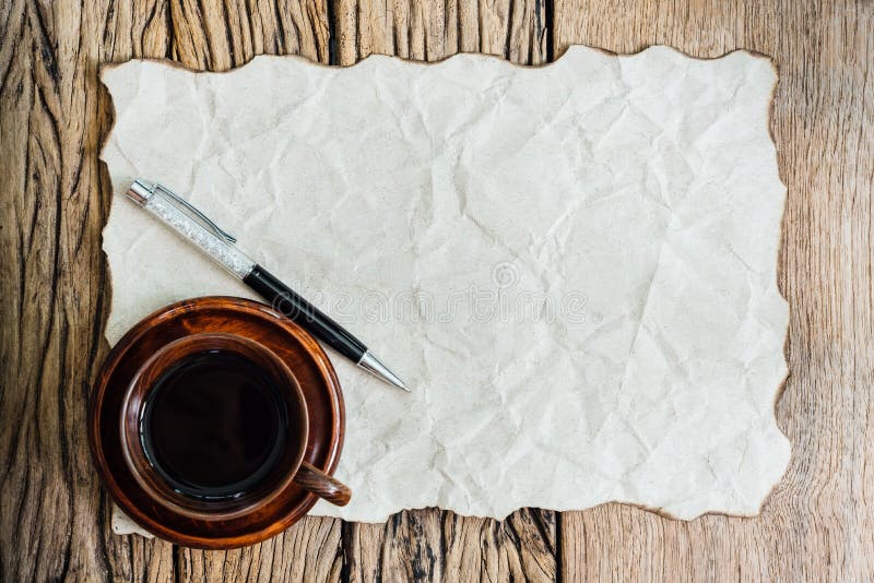 Blank Burned Paper with Pen and Coffee Cup on Old Wood Table. Stock ...