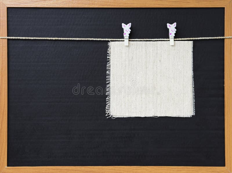 Blank Canvas Fabric Hanging on String Over Black Background Stock Photo ...