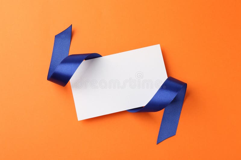 Blank Card and Blue Ribbon on Orange Background, Top View Stock Image ...