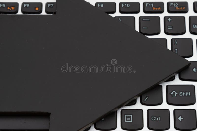 Blank Chalkboard Arrow on a Black and Silver Keyboard Stock Image ...