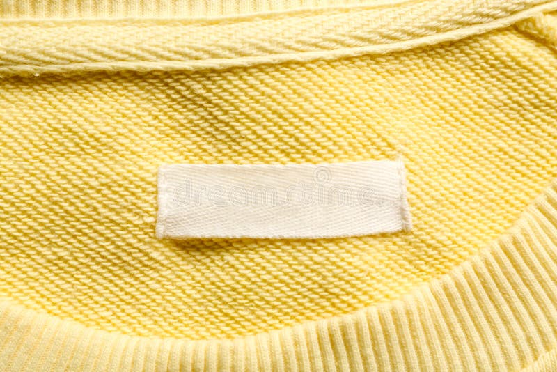 Blank Clothing Label on Yellow Sweater, Top View Stock Photo - Image of ...
