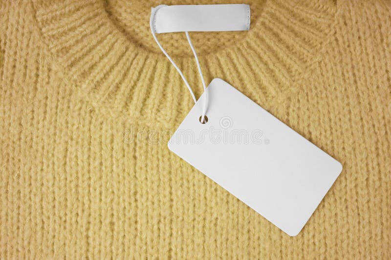 Blank Clothing Tag and Inner Label on Neck of Yellow Knitted Sweater ...