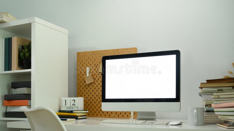Blank Computer Desktop, Pile of Book and Pegboard on White Table Stock ...