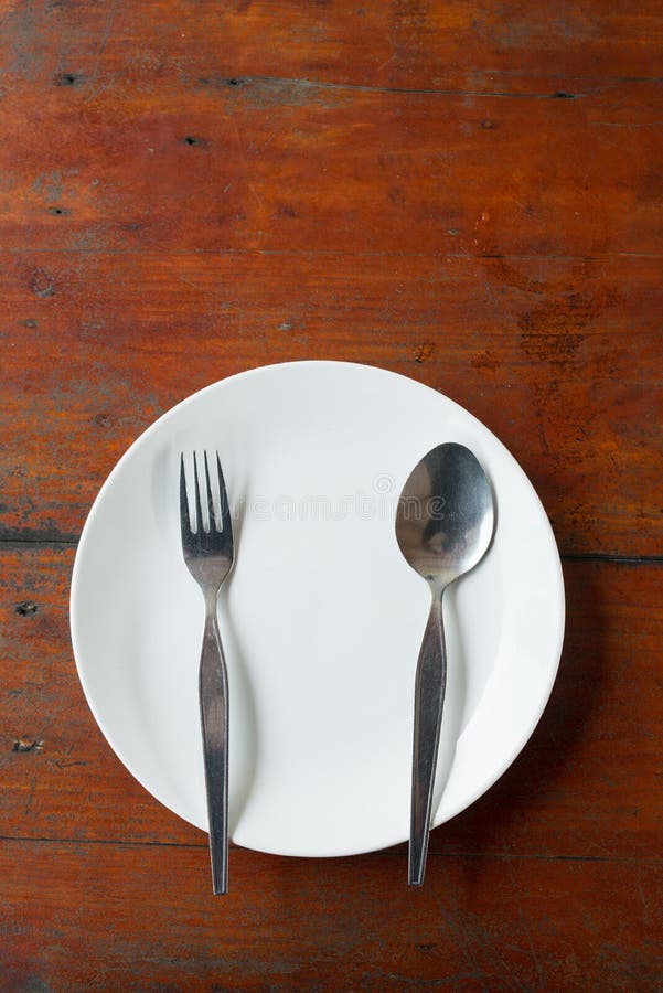 Blank dish, spoon and fork stock photo. Image of hungry - 34106696