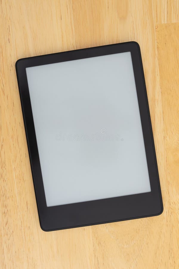Blank ereader on wood desk stock photo. Image of book - 364395088