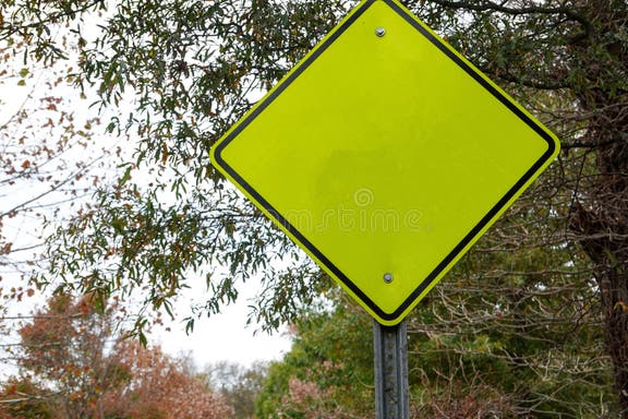 Blank Fluorescent Green Triangular Yield Sign with Trees in the ...