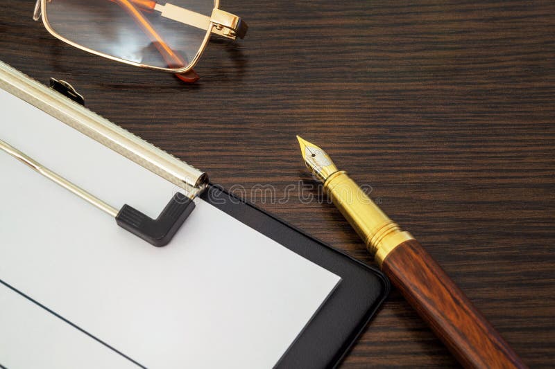 Blank Form and Pen for Drawing Up Report on Brown Wooden Table Stock ...