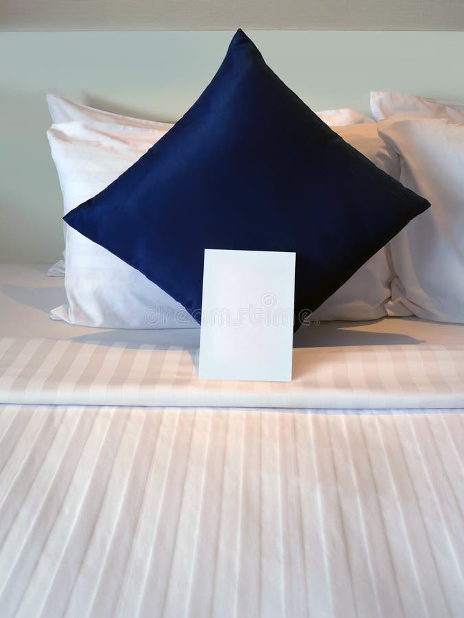 Blank Greetings Card at the Dark Blue Pillow on the Bed with Hotel Turn ...