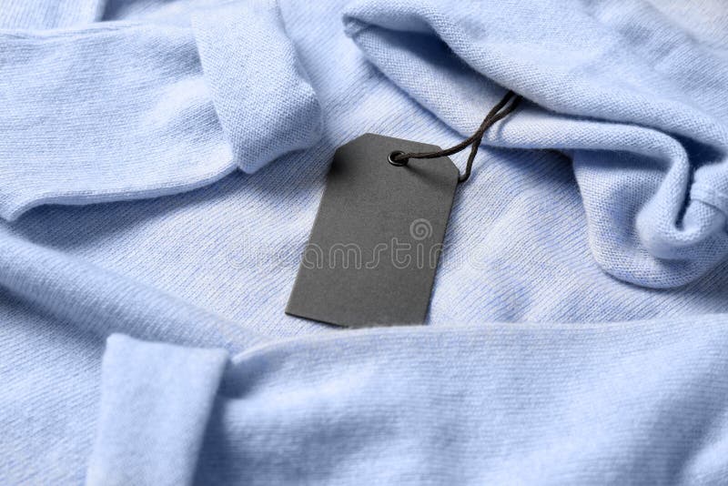 Blank Grey Tag on Light Blue Sweater. Space for Text Stock Image ...