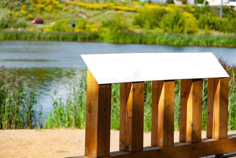 Blank Horizontal Information Sign in Park on Wooden Stand in Front of a ...