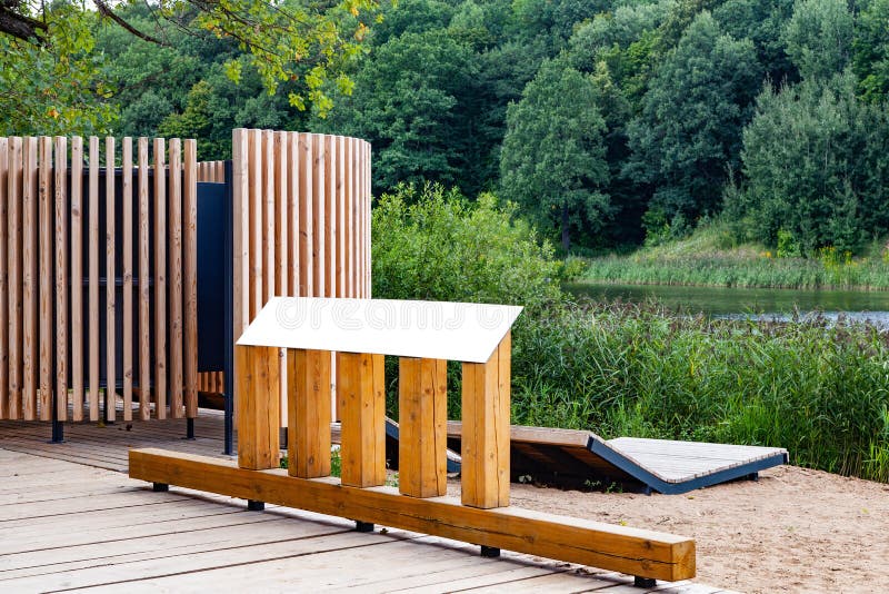 Blank Horizontal Information Sign on Wooden Stand in Park in Front of a ...
