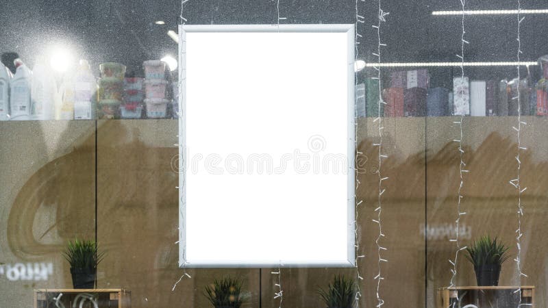 Blank Illuminated Poster Frame Displayed in Storefront Window with ...