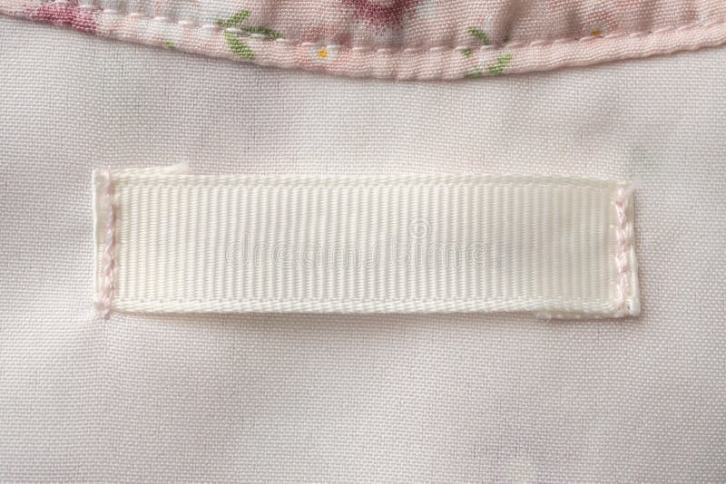 Blank Laundry Care Clothes Label on Fabric Texture Background Stock ...