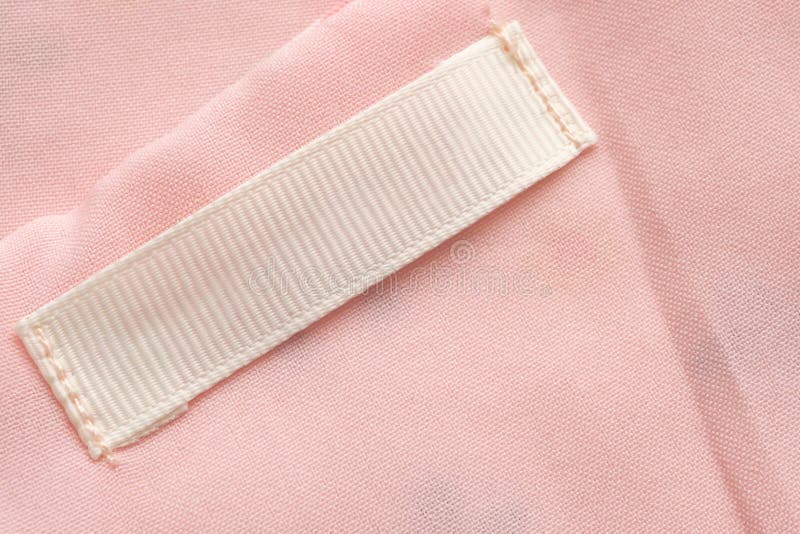 Blank Laundry Care Clothes Label on Fabric Texture Background Stock ...