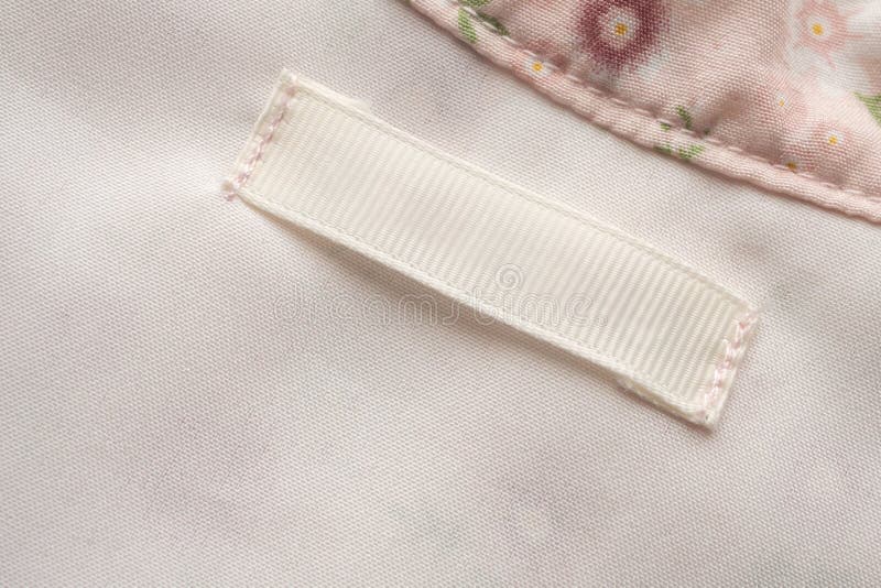 Blank Laundry Care Clothes Label on Fabric Texture Background Stock ...