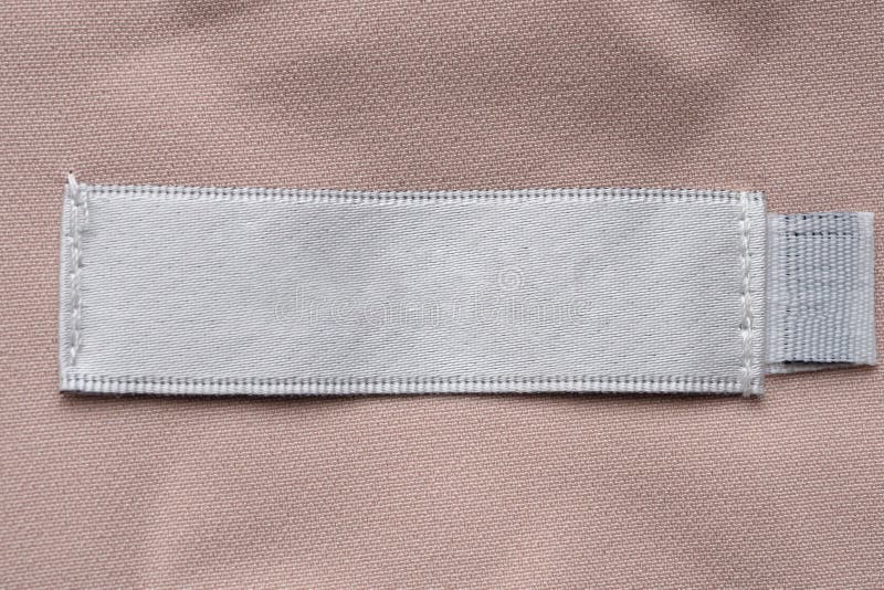 Blank Laundry Care Clothes Label on Fabric Texture Background Stock ...