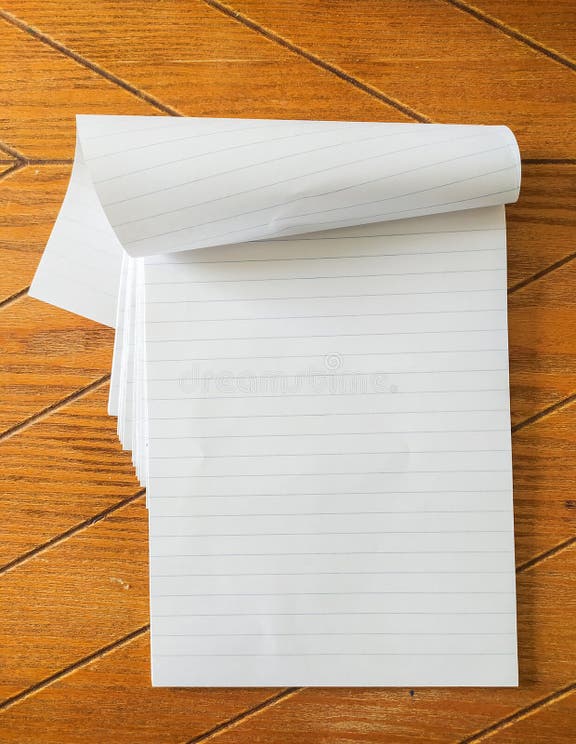 Blank Lined Notepad Rests on a Wood Grain Surface. Perfect for Adding ...