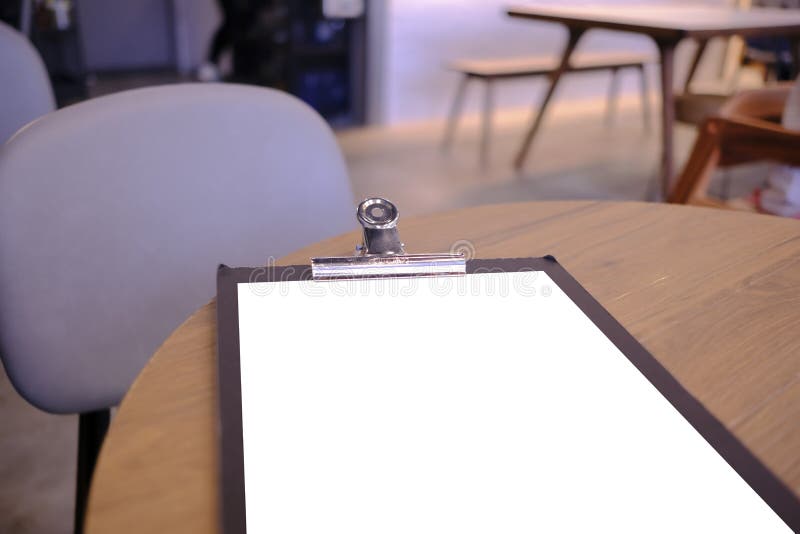 Blank Menu on Clipboard on Dining Table in Restaurant; Cafe Menu or ...