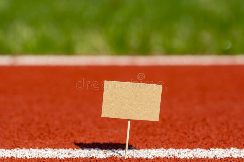 Blank Mini Paper Pointer on a Running Track Stock Image - Image of sign ...