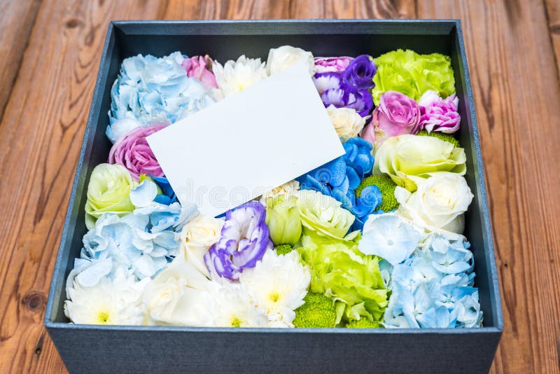 Blank note on flowers stock image. Image of present - 104527933