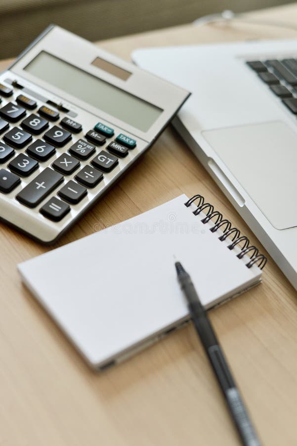 Blank Note Pad, Calculator, Computer, Pen on the Table Stock Image ...