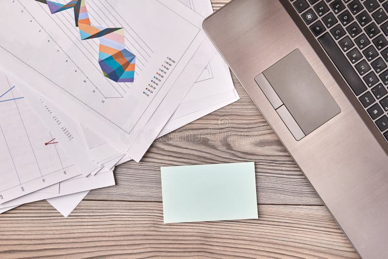 Blank Note Paper for Copy Space with Charts and Laptop. Stock Photo ...