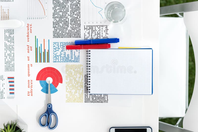 Blank Notebook, Business Charts and Office Supplies at Workplace Stock ...