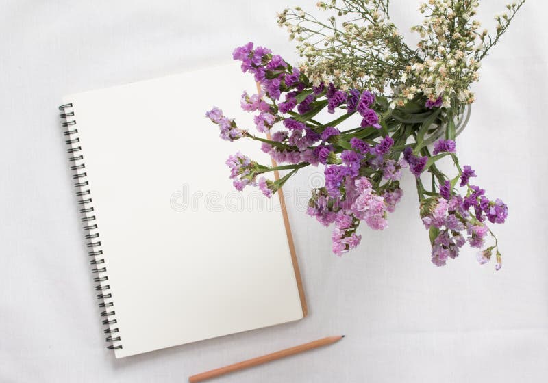 Blank notebook and flower stock image. Image of note - 76180191