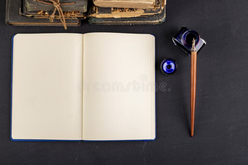 Old Books and a Notebook on a Wooden Table. Letters Cut from Wood ...