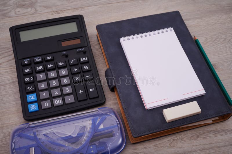 Blank Notebook Page with a Calculator and Geometric Stationery Sets on ...