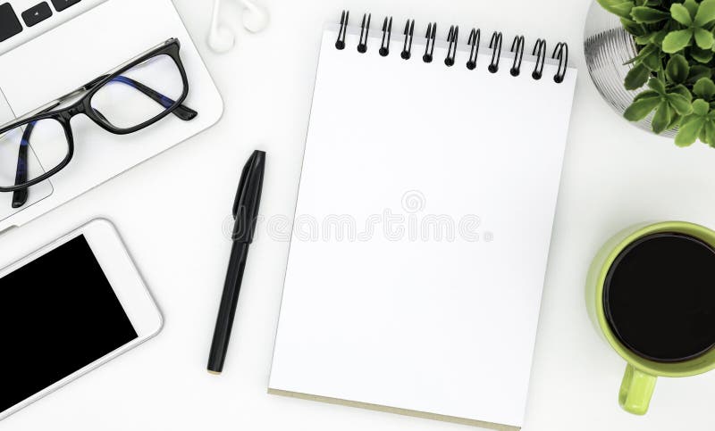 Blank Notebook Page in the Middle of White Office Desk Table. Top View ...