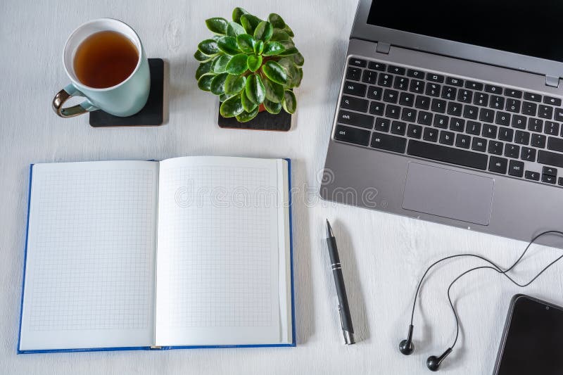 Blank Notebook with Pen and Laptop, Smartphone and Cup of Tea on White ...