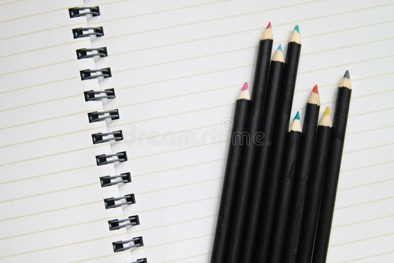 Blank Notebook with Row of Crayon Stock Photo - Image of close, line ...