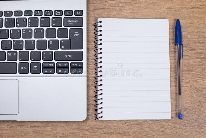 Blank Notepad with Blue Pen Next To Laptop Stock Photo - Image of space ...