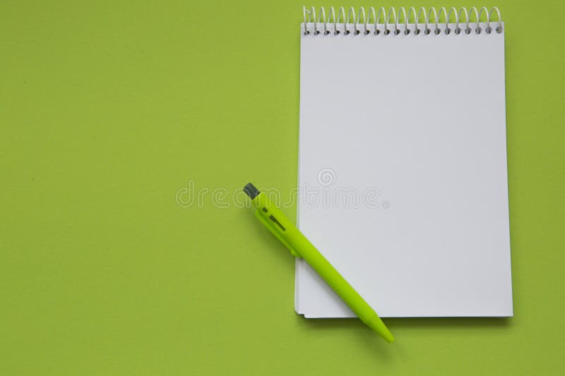 Notepad with Green Pencil on Light Green Background Stock Image - Image ...