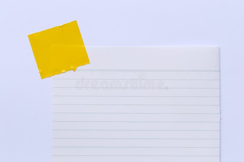 Blank Notepad with a Yellow Glue Tape Affixed at the Top on White ...