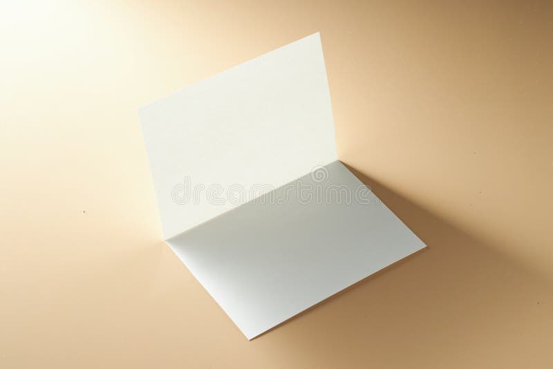 Blank Open Card Resting on a Smooth Surface Capturing Natural Light in ...
