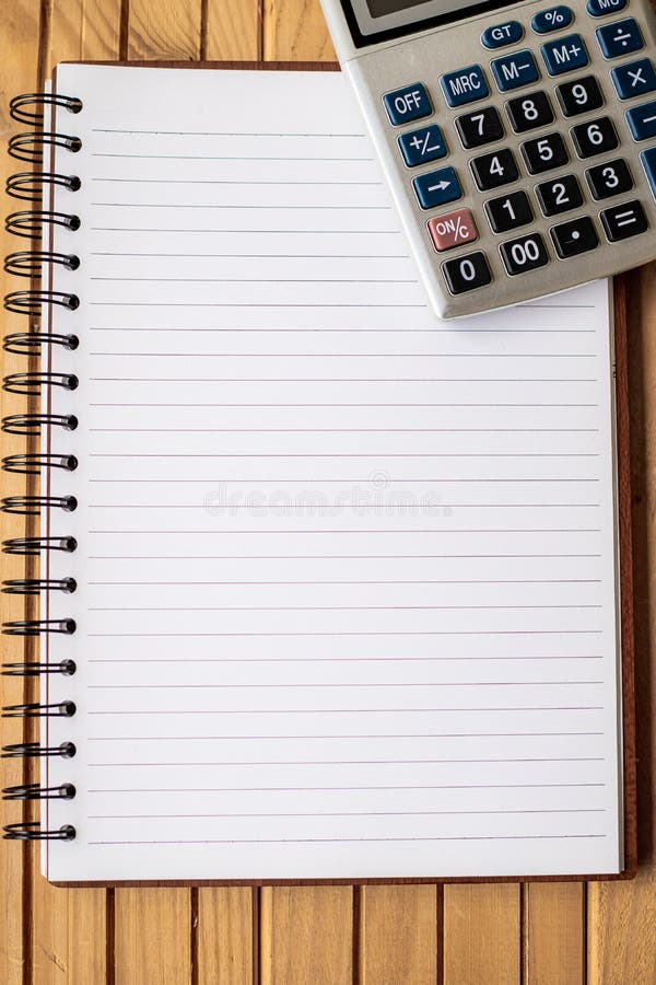 Blank Opened Spiral Notebook with a Calculator Placed on a Table. Empty ...