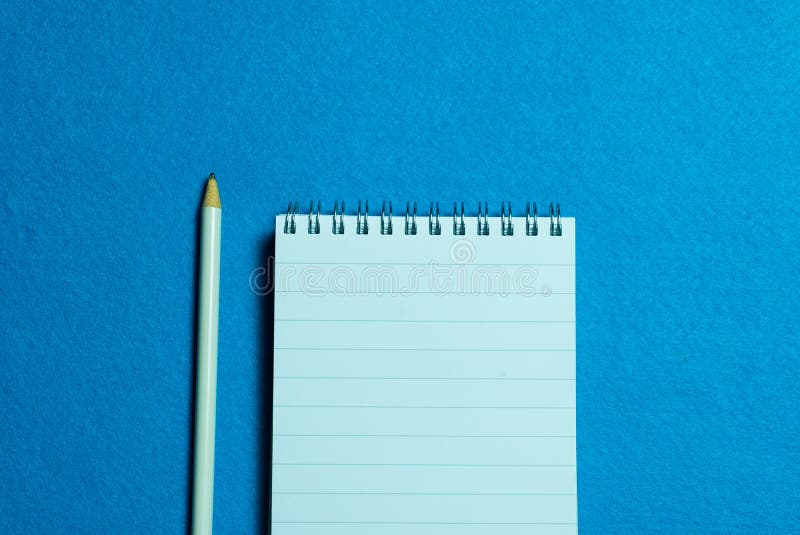 Blank Page of Notebook and Pencil on Light Blue Background Stock Photo ...