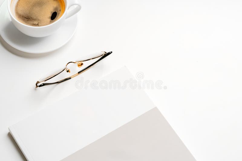 Blank Paper, Coffee Cup and Glasses on White Desk from Above Stock ...